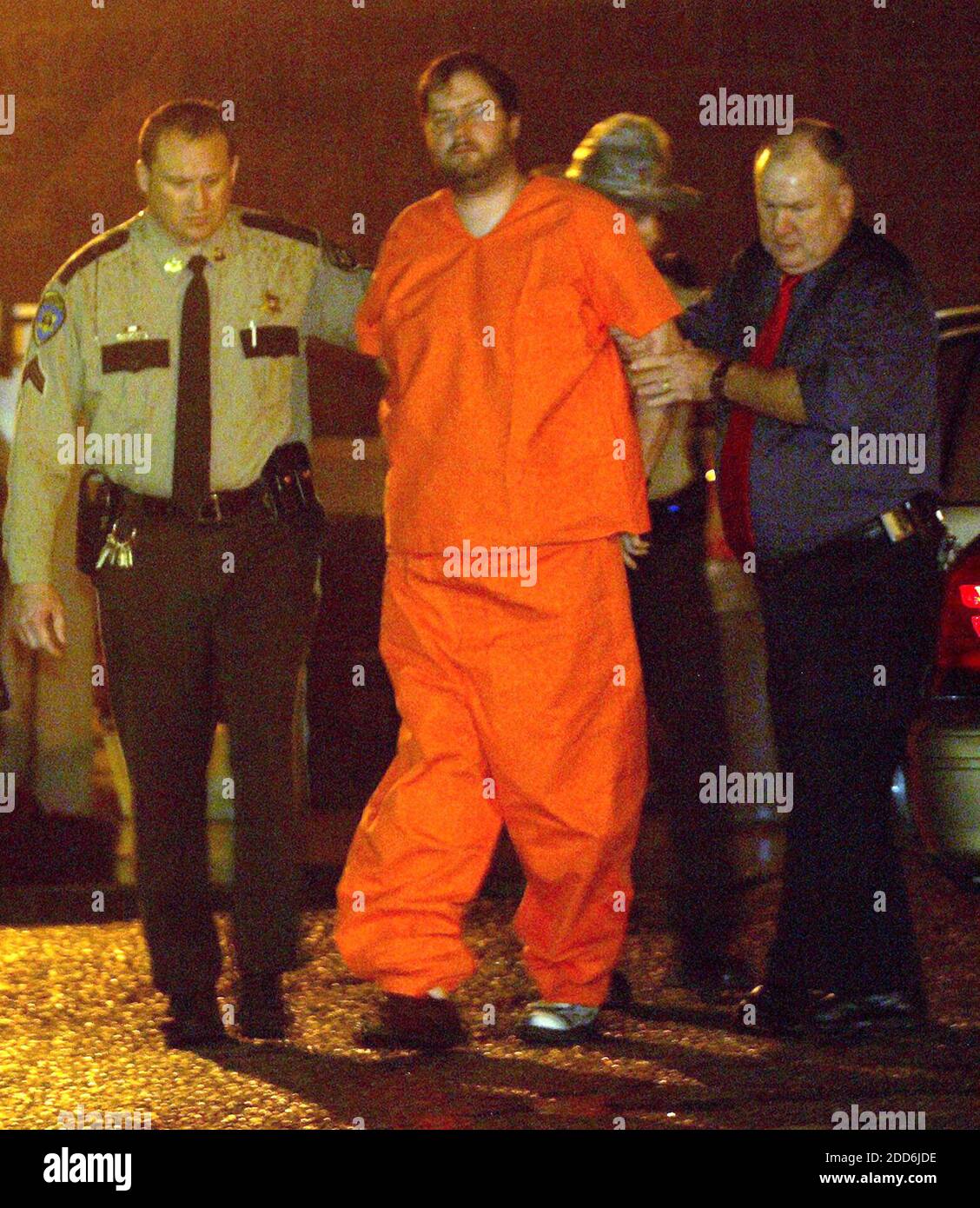 NO FILM, NO VIDEO, NO TV, NO DOCUMENTARY - Michael Devlin, 41, (center ...