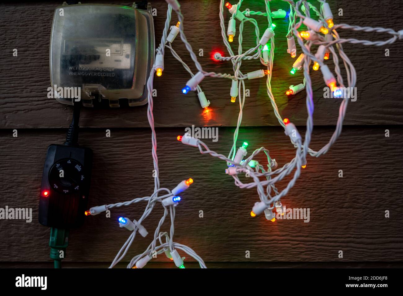 Outdoor setup and installation of Christmas decorations using a timer ...