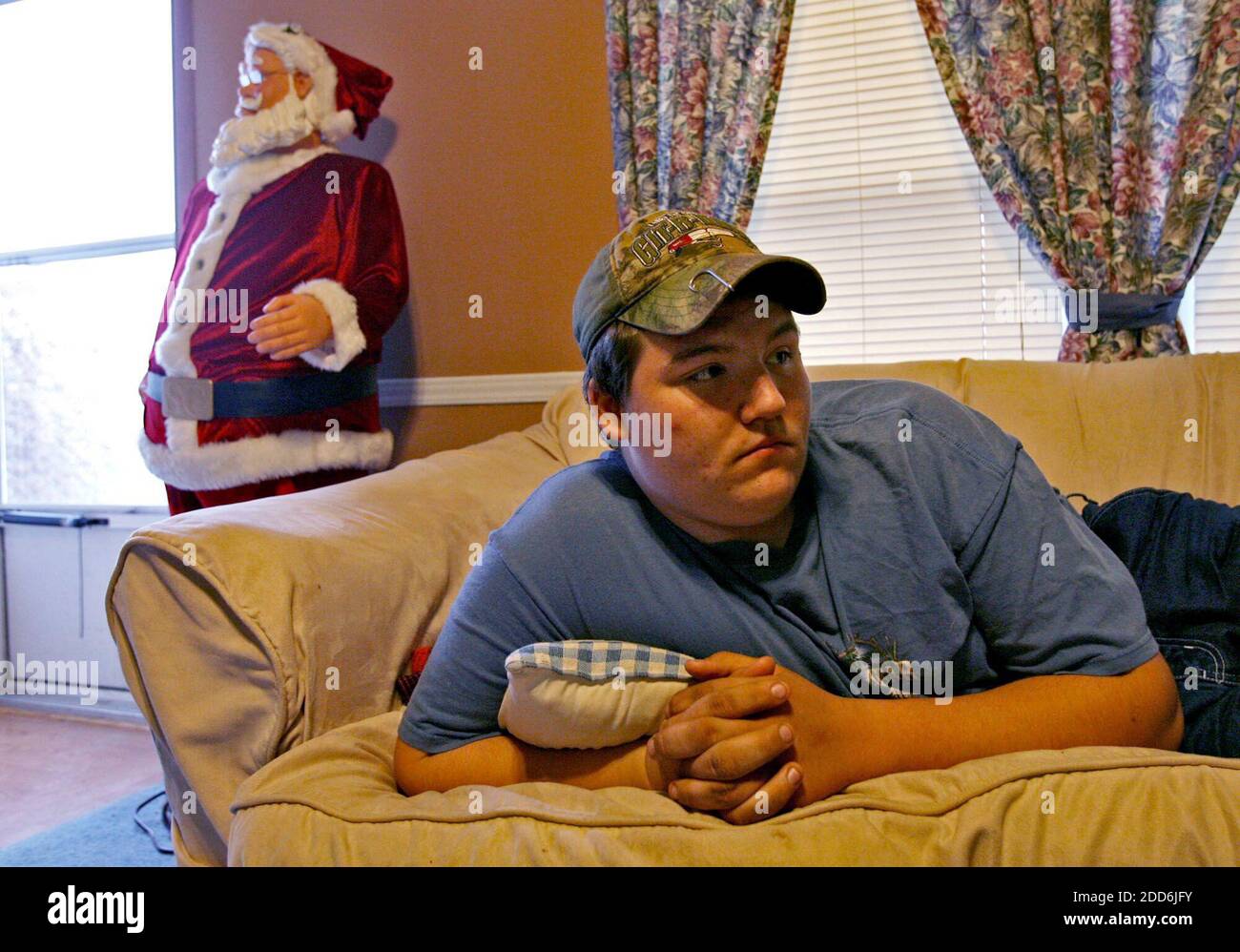 NO FILM, NO VIDEO, NO TV, NO DOCUMENTARY - Mitchell Hults, 15, watches ...