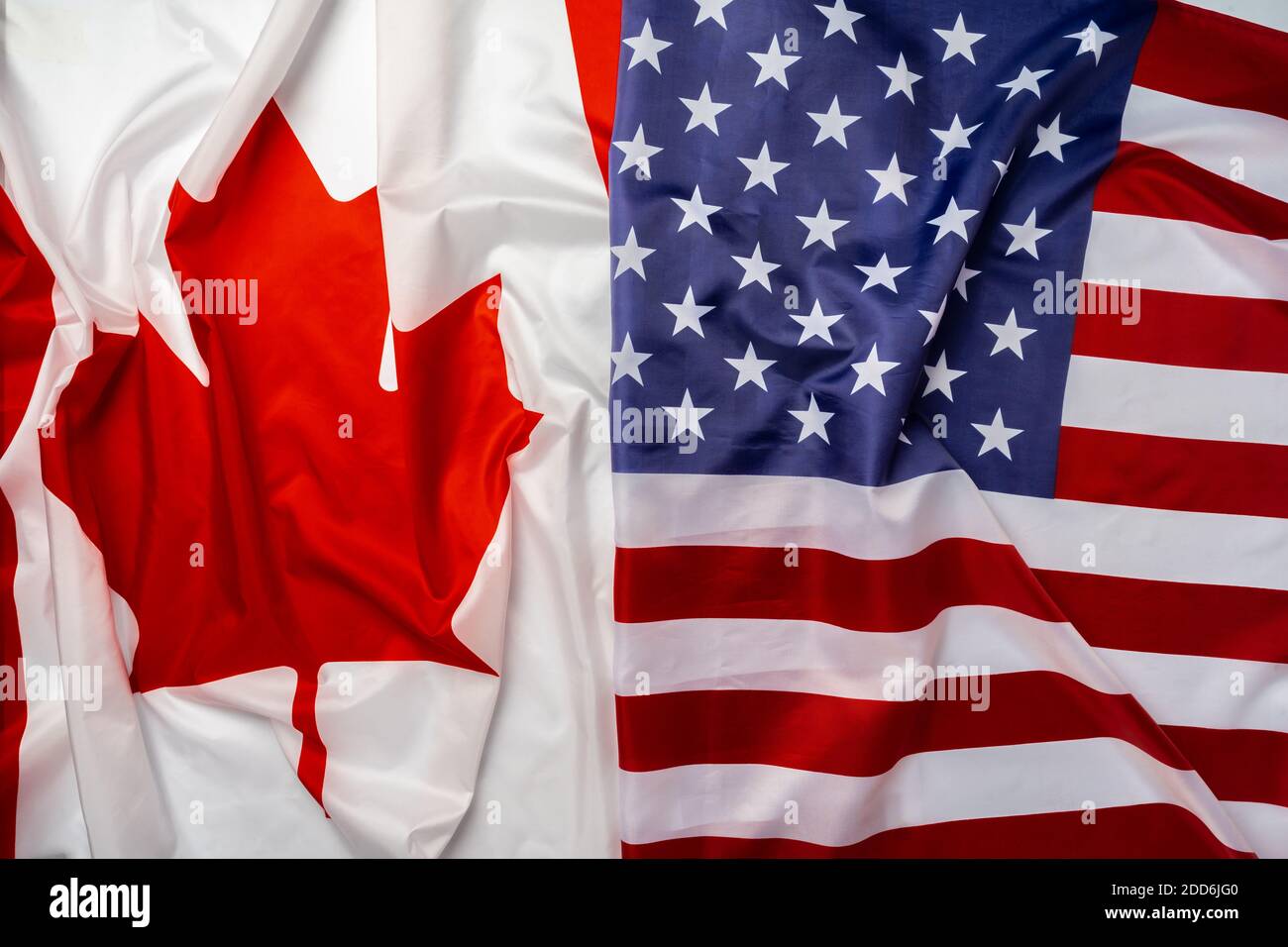 Flags of Canada and USA folded together Stock Photo - Alamy