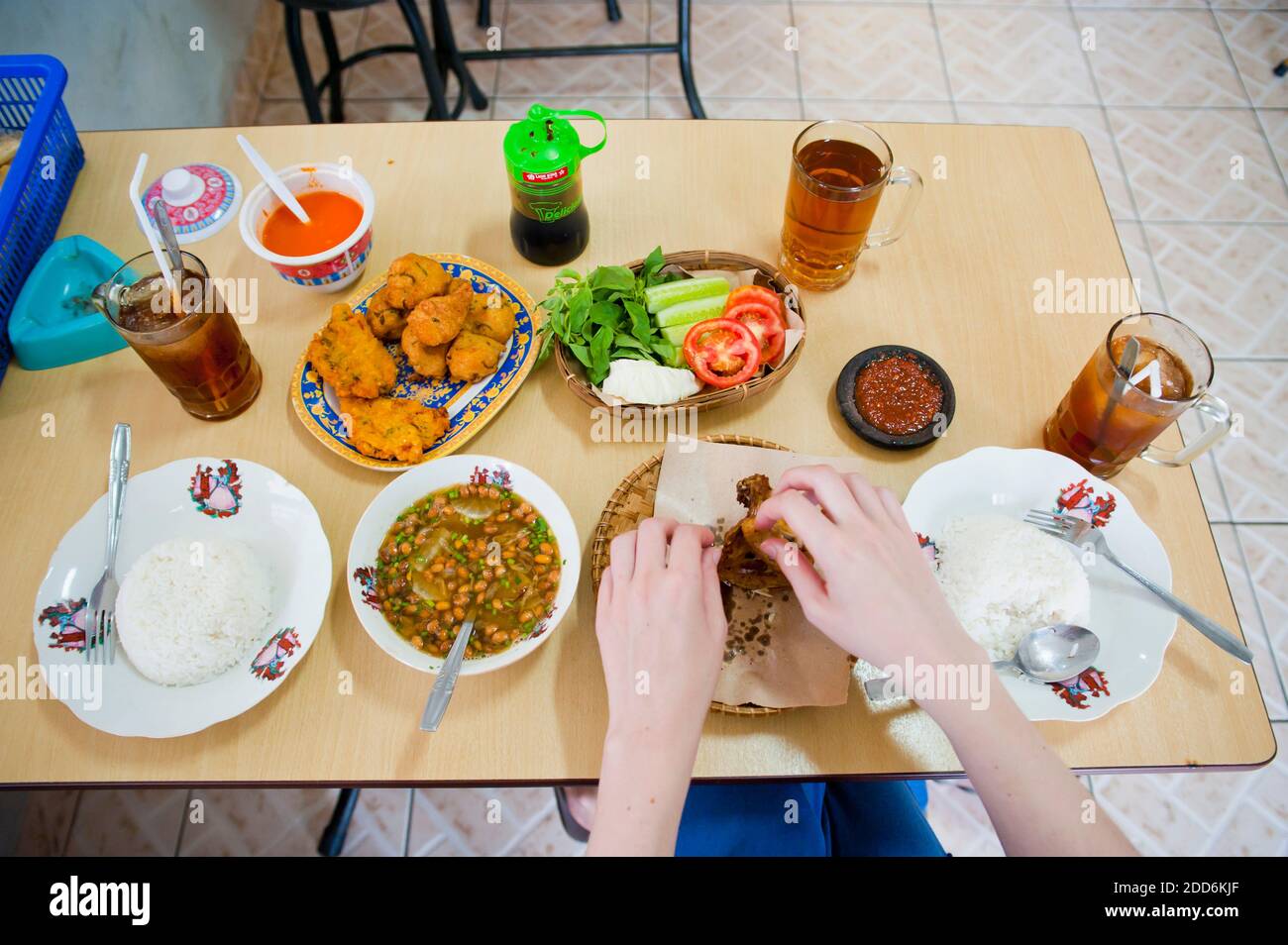 Indonesian food, tourist eating at a Restaurant in Bandung, Java ...