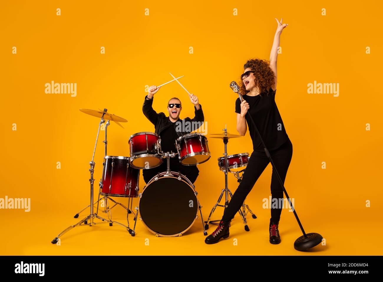 Full body photo of rock group handsome guy play instruments raise ...
