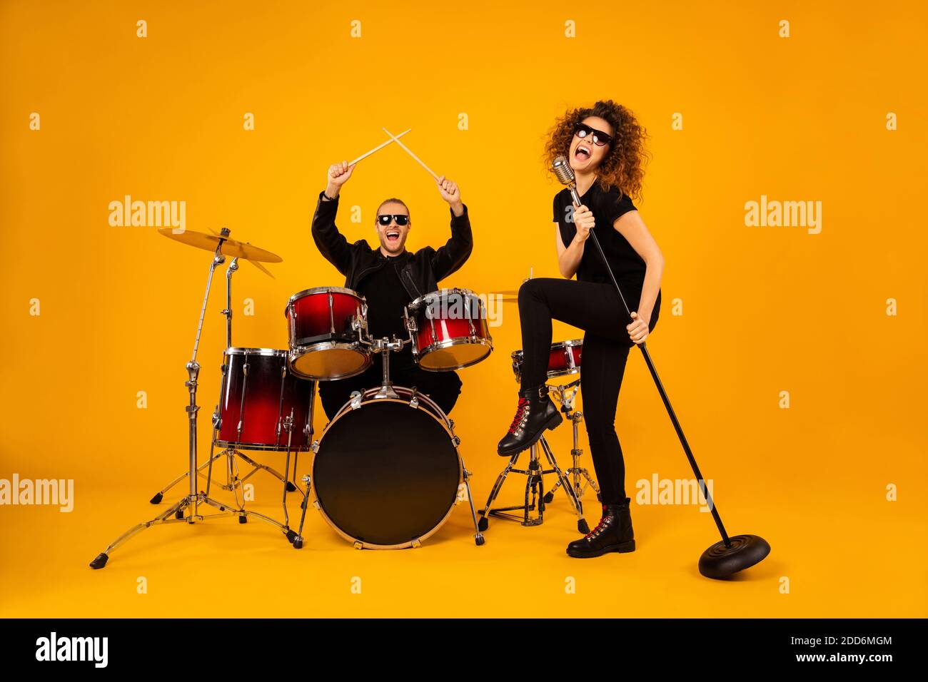 Full body photo of cool rock group handsome guy play drum instruments ...