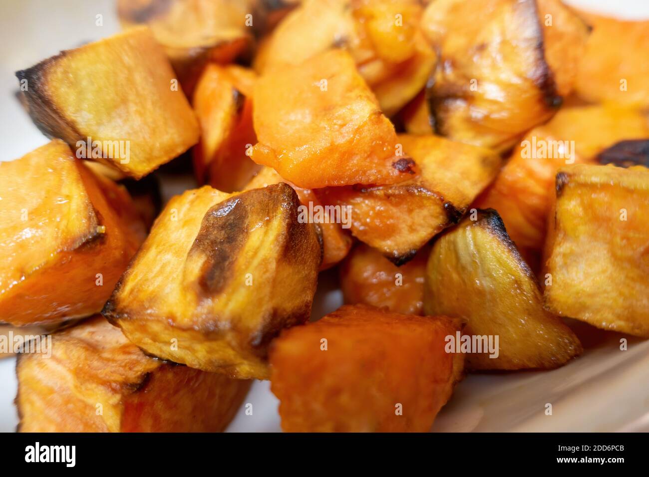 Roasted sweet potatoe chunks close-up Stock Photo - Alamy