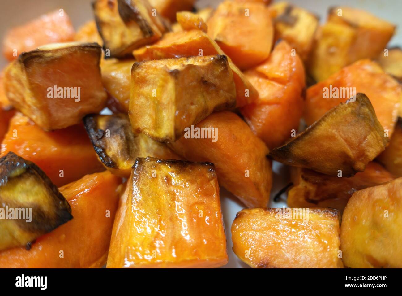 Roasted sweet potatoe chunks close-up Stock Photo - Alamy