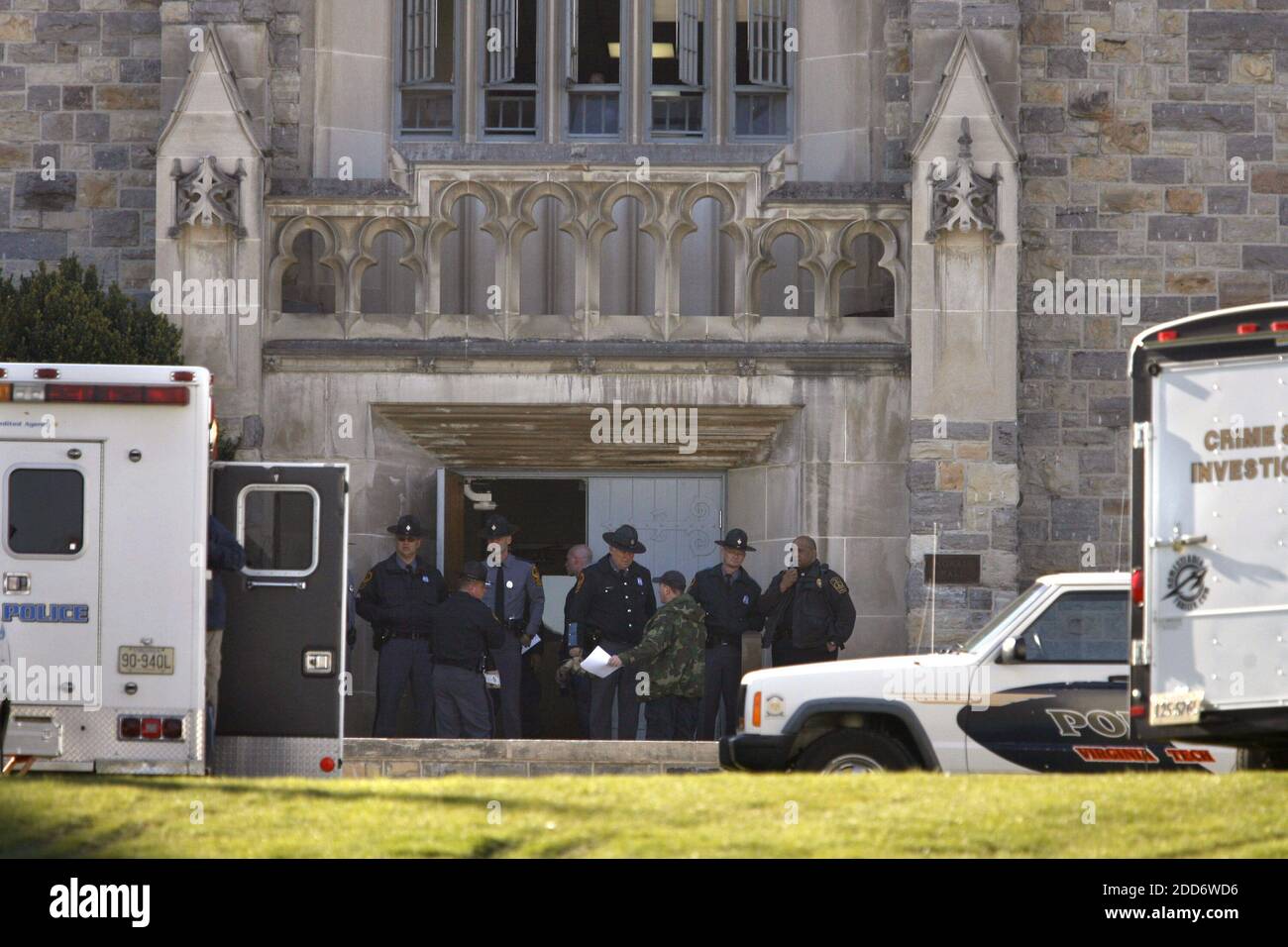 NO FILM, NO VIDEO, NO TV, NO DOCUMENTARY - Police offiers stand outside ...