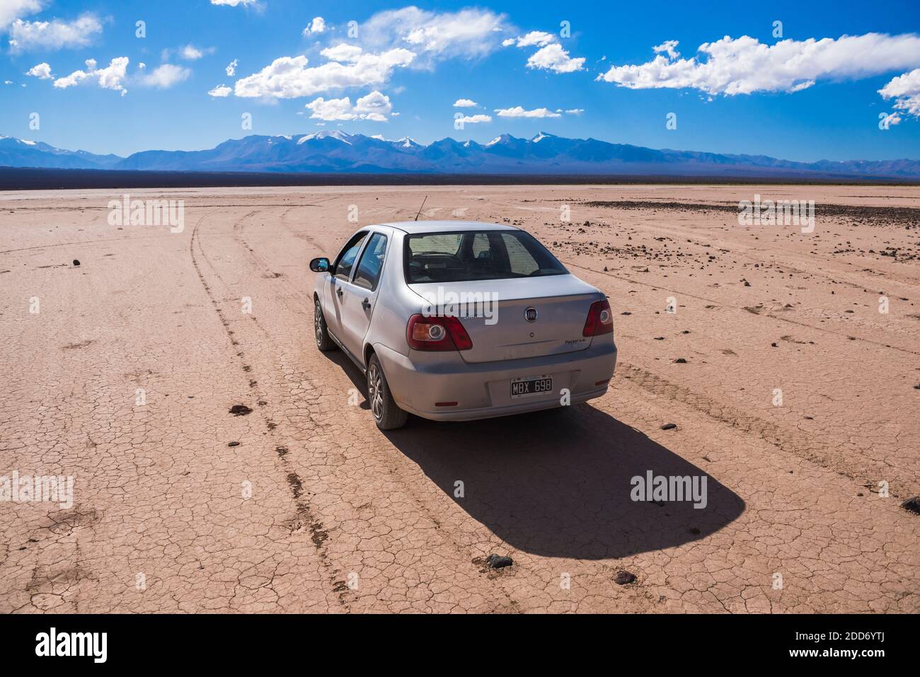 Driving on El Barreal Blanco de la Pampa del Leoncito, a dried river ...