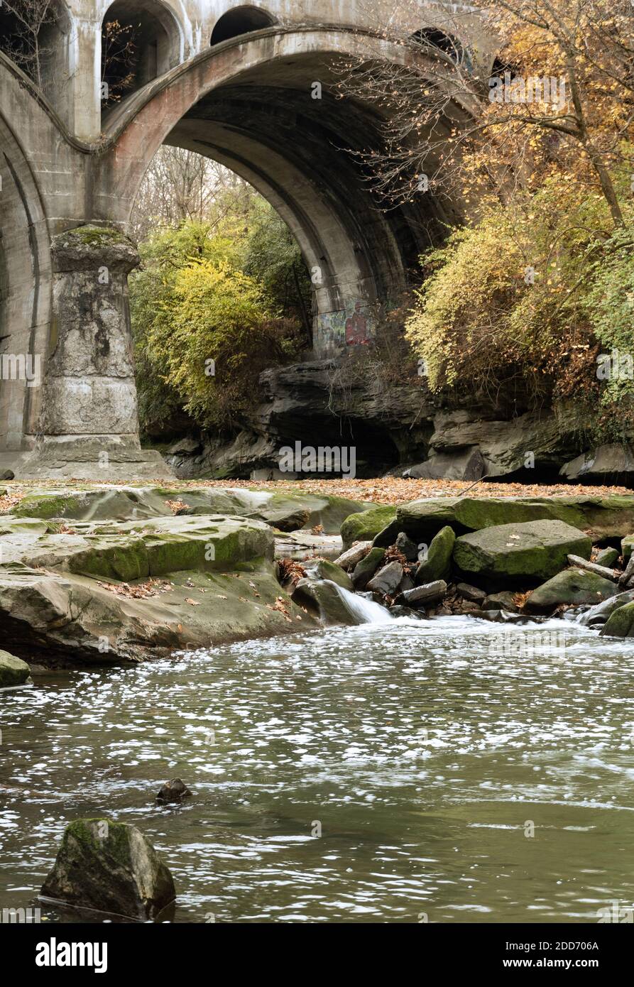 A river with a century old railroad bridge holding the scene Stock ...