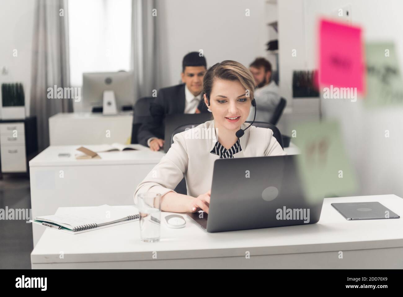 A call center employee sits at a Desk in the office of a large ...