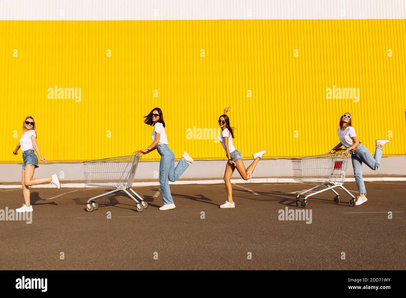 Group of happy young people having on shopping carts, young people ...