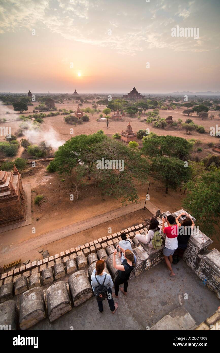 Tourists watching the sunrise over the Temples of Bagan (Pagan ...