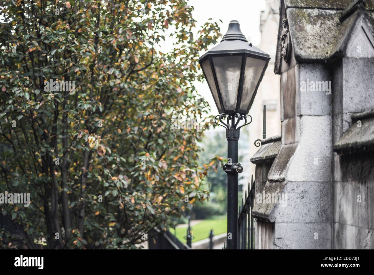 Old fashioned retro lamp post light in London showing architectural ...
