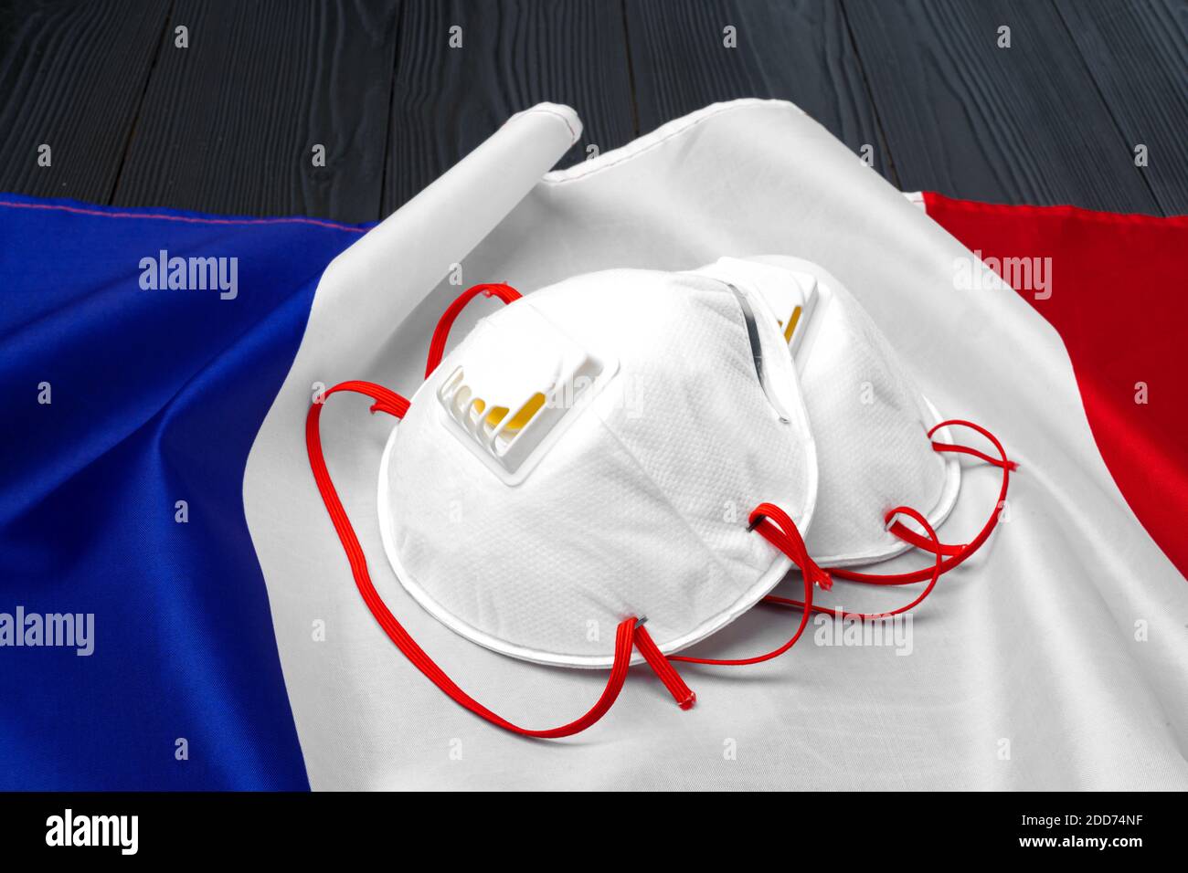 Medical mask on national flag of France Stock Photo - Alamy