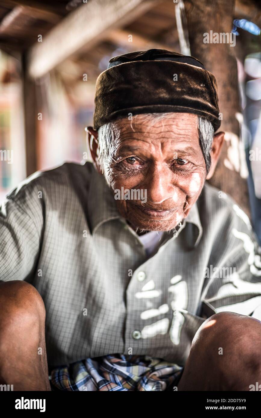 Portrait of an old wrinkled man at Sungai Pinang, a traditional ...
