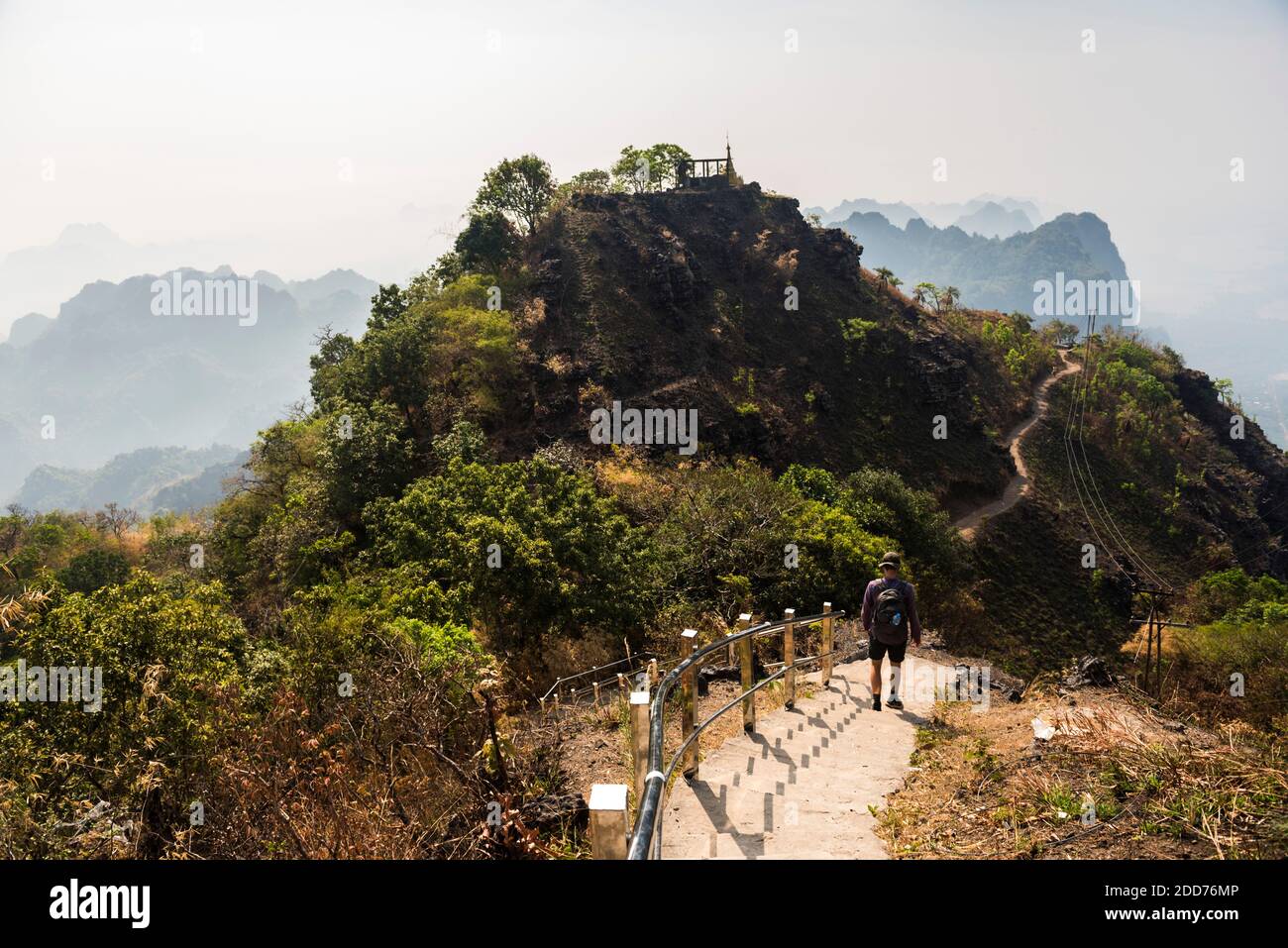 Tourist climbing Mount Zwegabin at sunrise, Hpa An, Kayin State (Karen ...