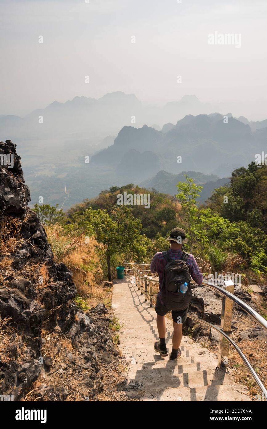 Tourist climbing Mount Zwegabin at sunrise, Hpa An, Kayin State (Karen ...