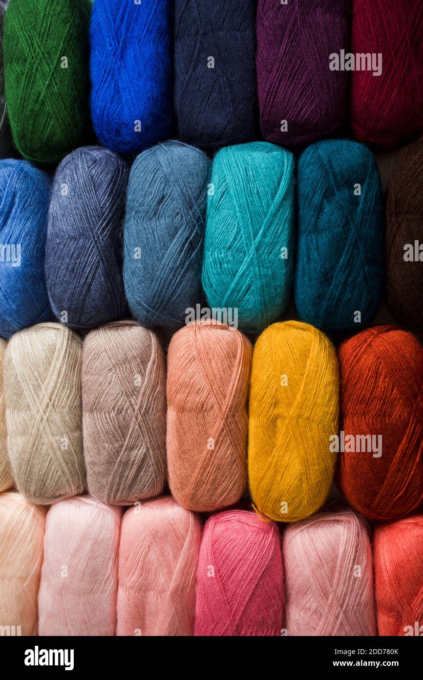 Various colors of wool yarn balls as a background Stock Photo - Alamy