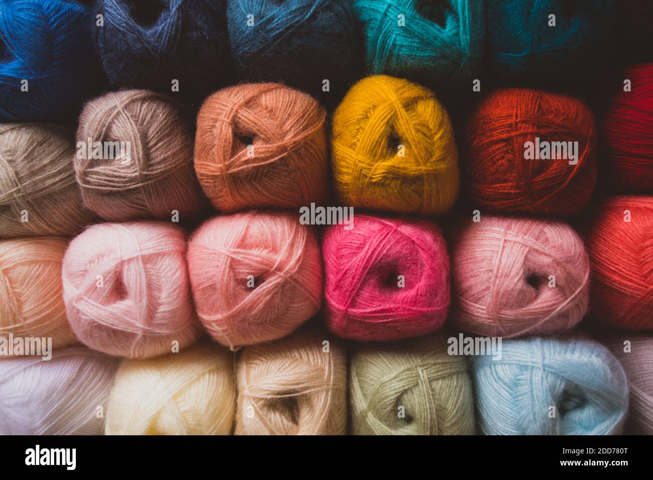 Trendy colours of yarn balls at the shop Stock Photo - Alamy