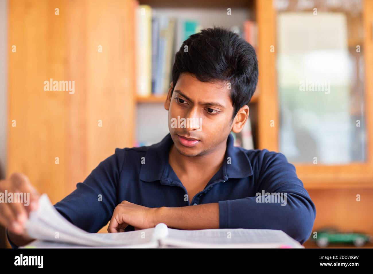 young man student learning in a room Stock Photo - Alamy