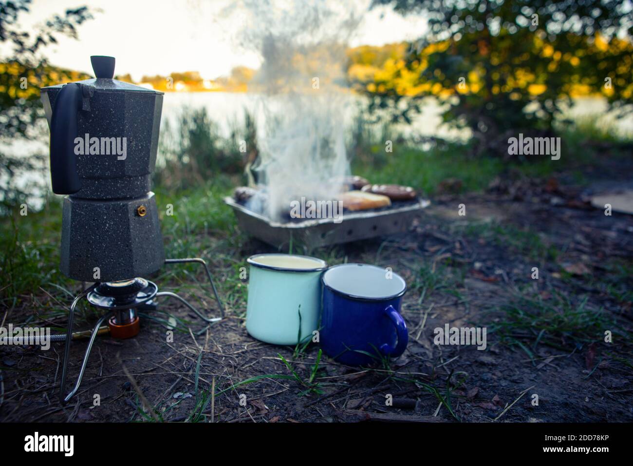 bbq cooking coffee at evening lake beach Stock Photo - Alamy