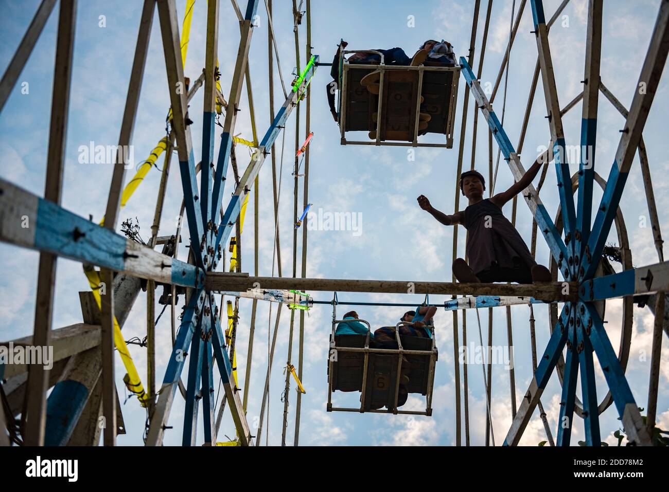 Hand operated ferris wheel at Pindaya Cave Festival, Shan State ...