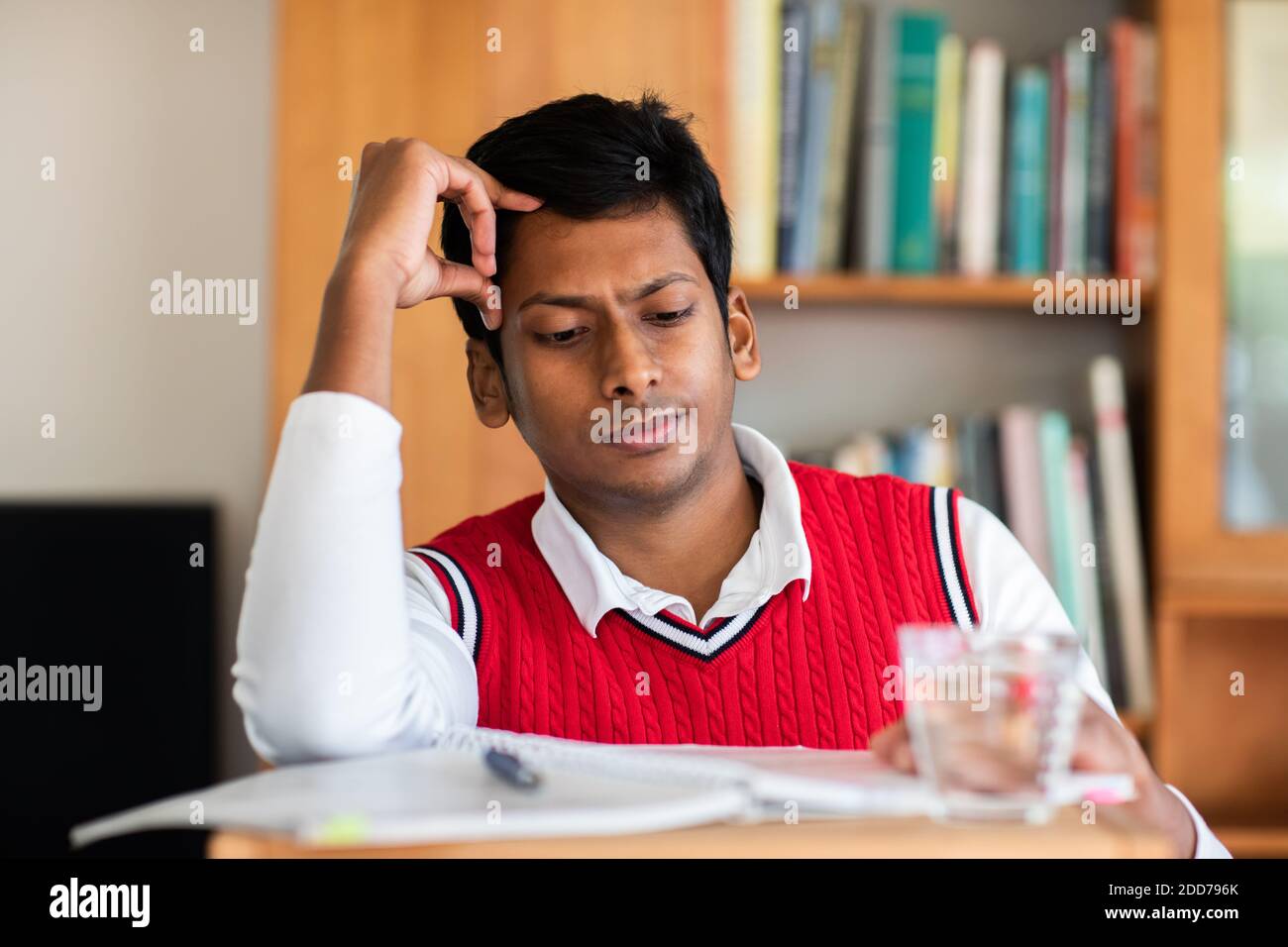 young man student learning in a room Stock Photo - Alamy