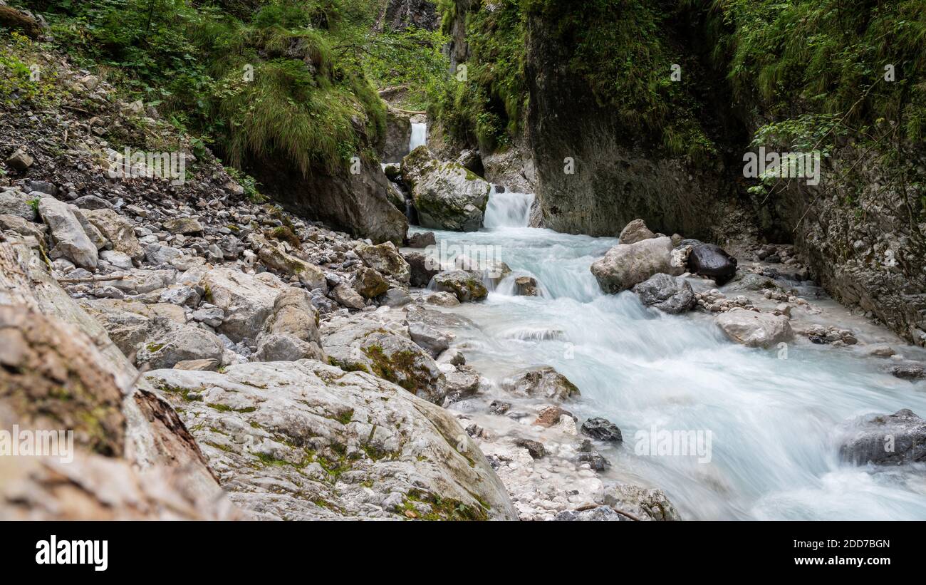 Stream of water flowing through beautiful rocky and mossy nature Stock ...