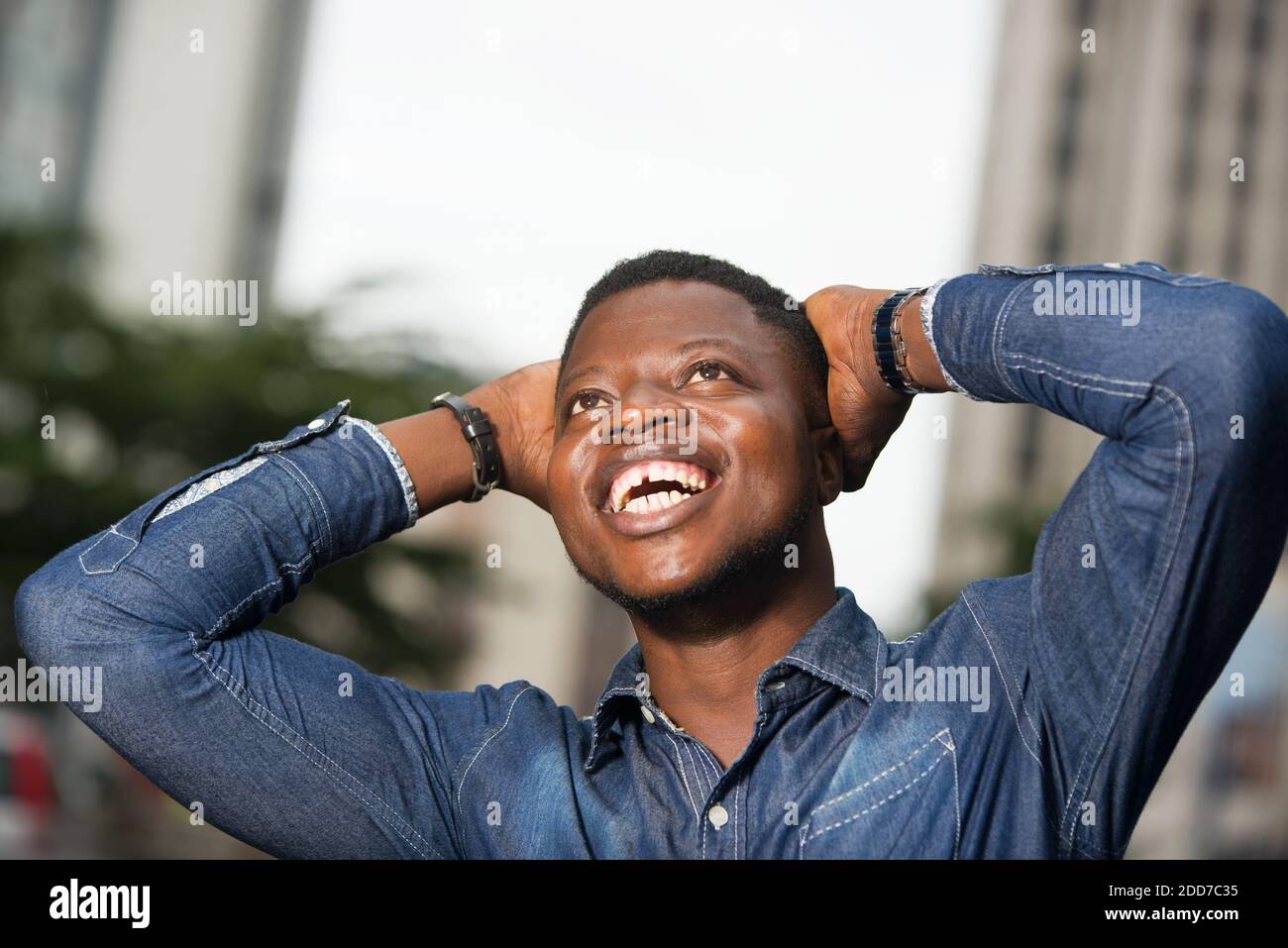 Happy man celebrating his success outdoors. Dynamic image of the male ...