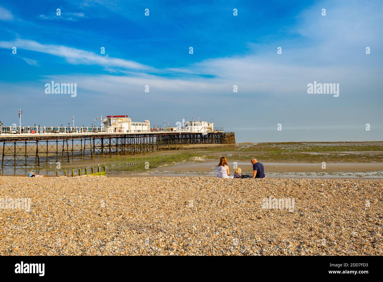 View of Worthing seafront during the day with light cloud and two ...