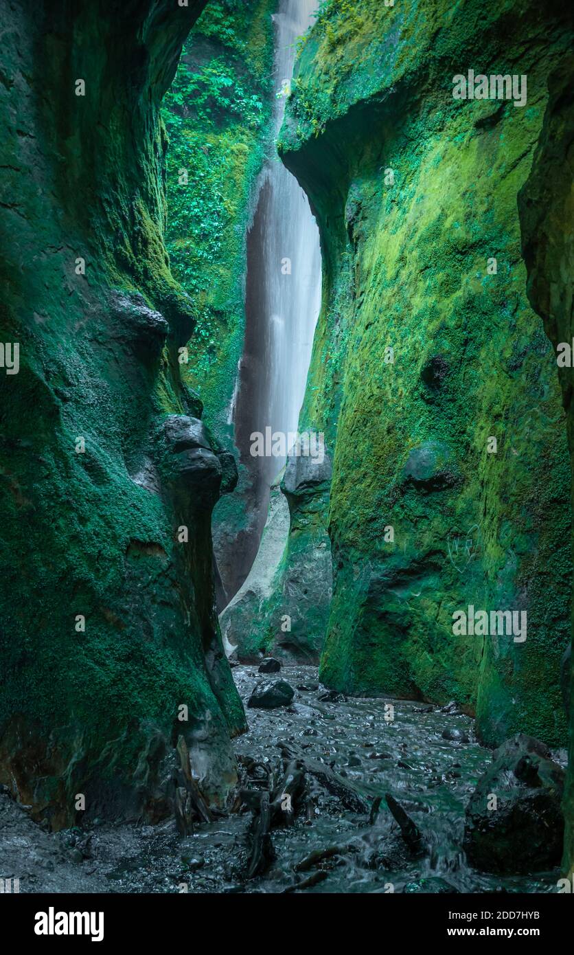 Waterfall hidden in a cave Stock Photo - Alamy