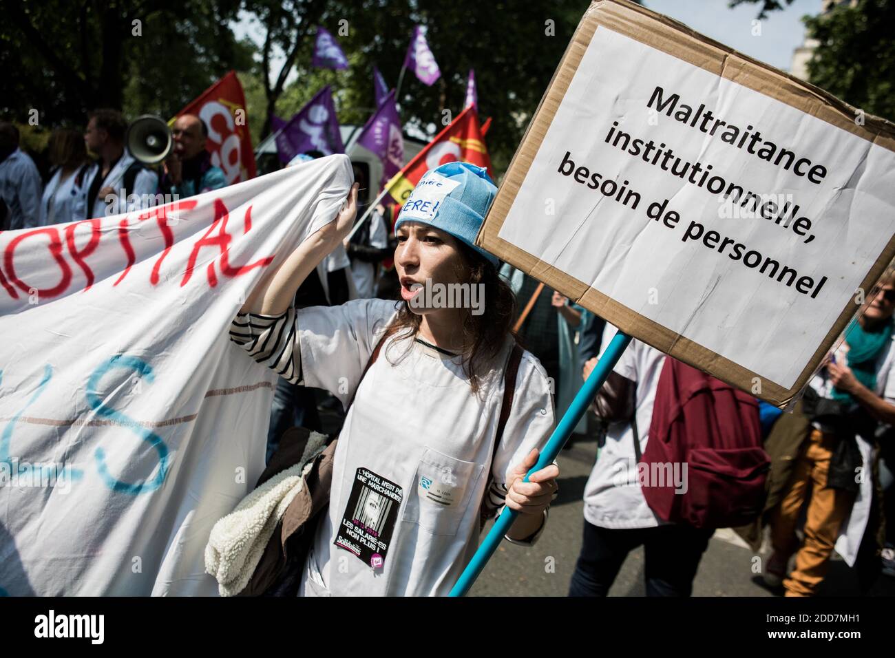 Hospital employees demonstrate against workforce reduction and call for ...