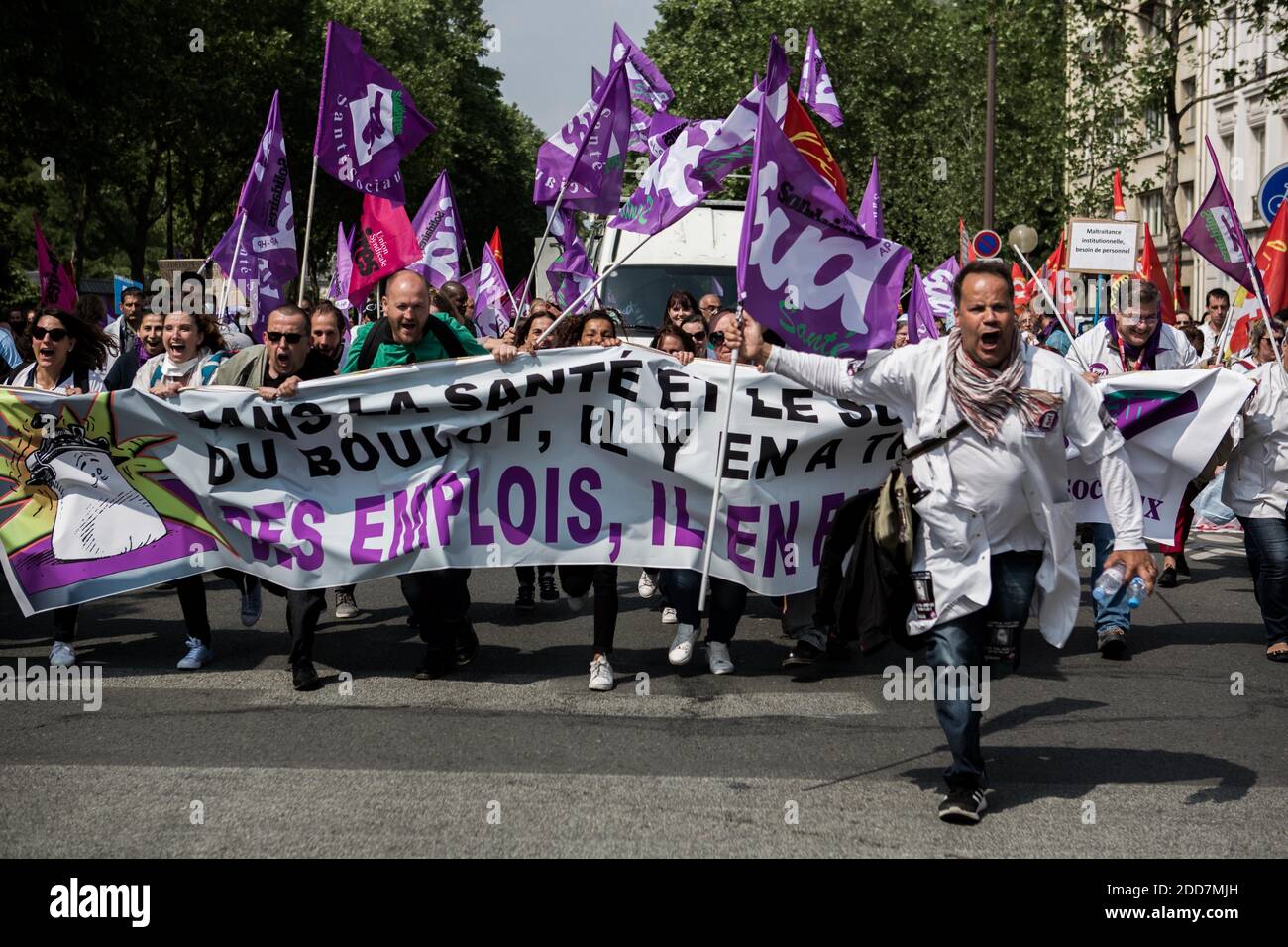 Hospital employees demonstrate against workforce reduction and call for ...