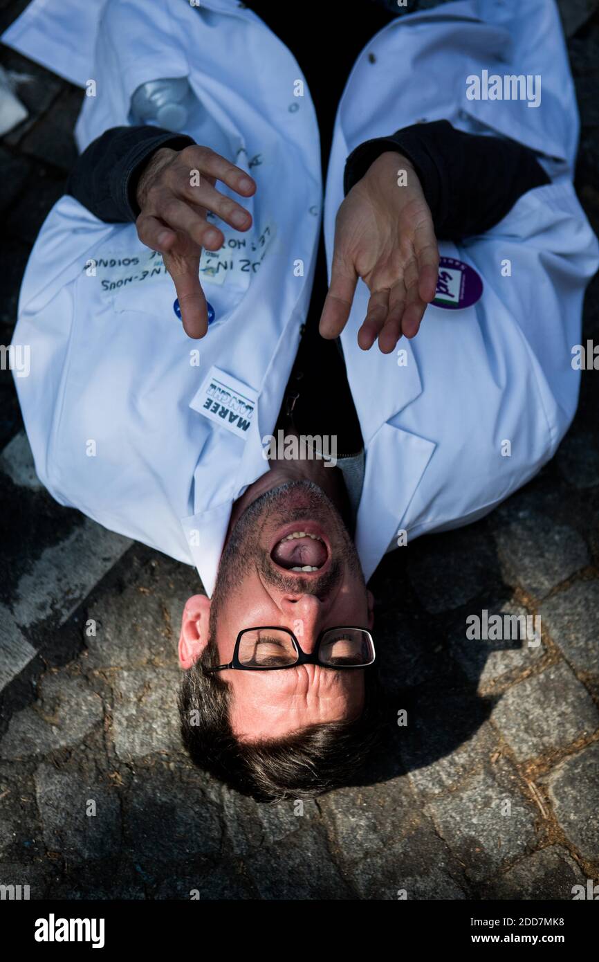 Hospital employees demonstrate against workforce reduction and call for ...