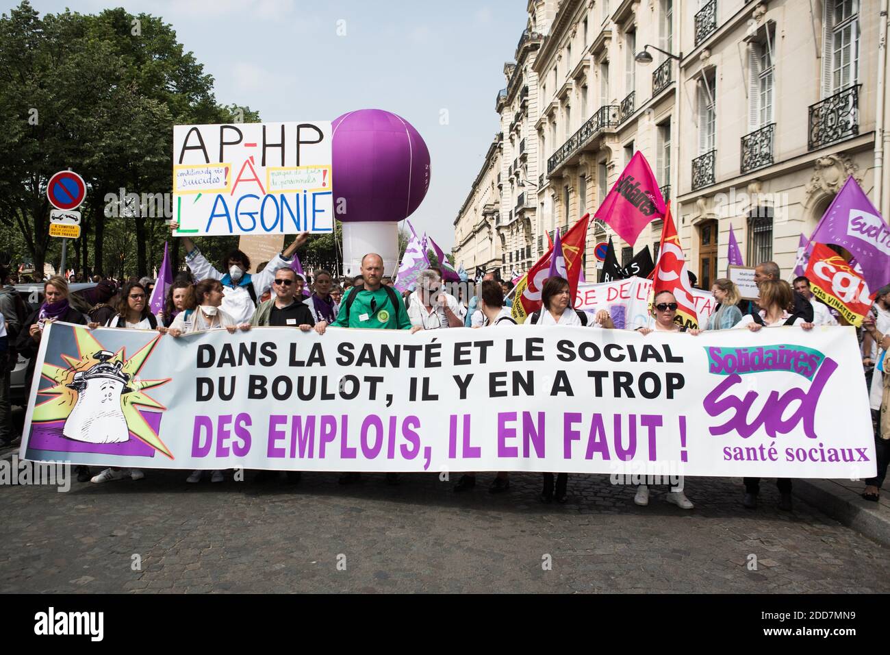 Hospital employees demonstrate against workforce reduction and call for ...