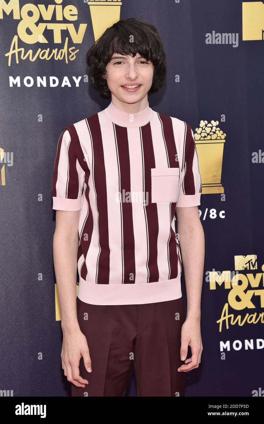 Finn Wolfhard attends the 2018 MTV Movie And TV Awards at Barker Hangar ...