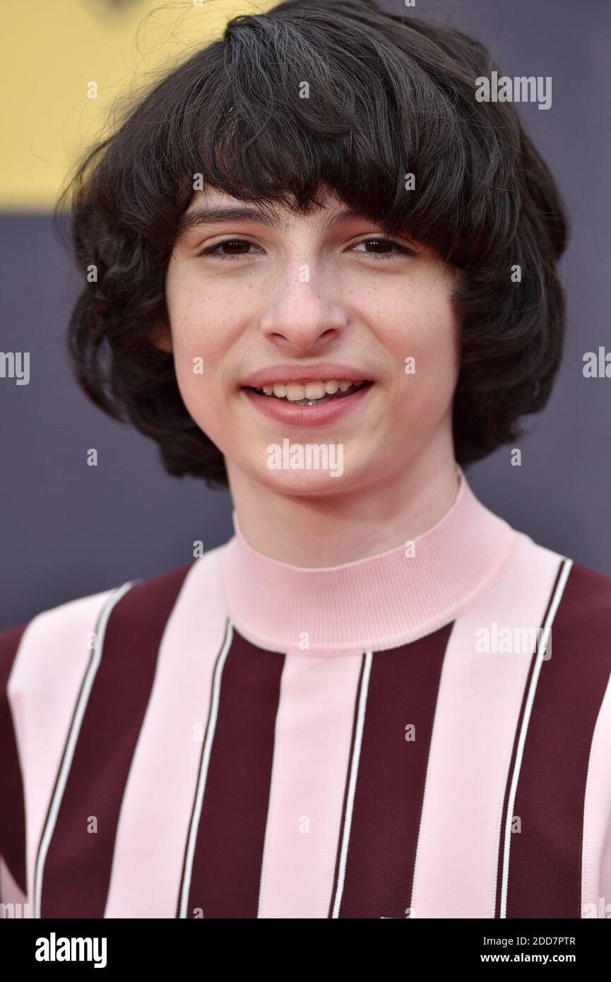 Finn Wolfhard attends the 2018 MTV Movie And TV Awards at Barker Hangar ...