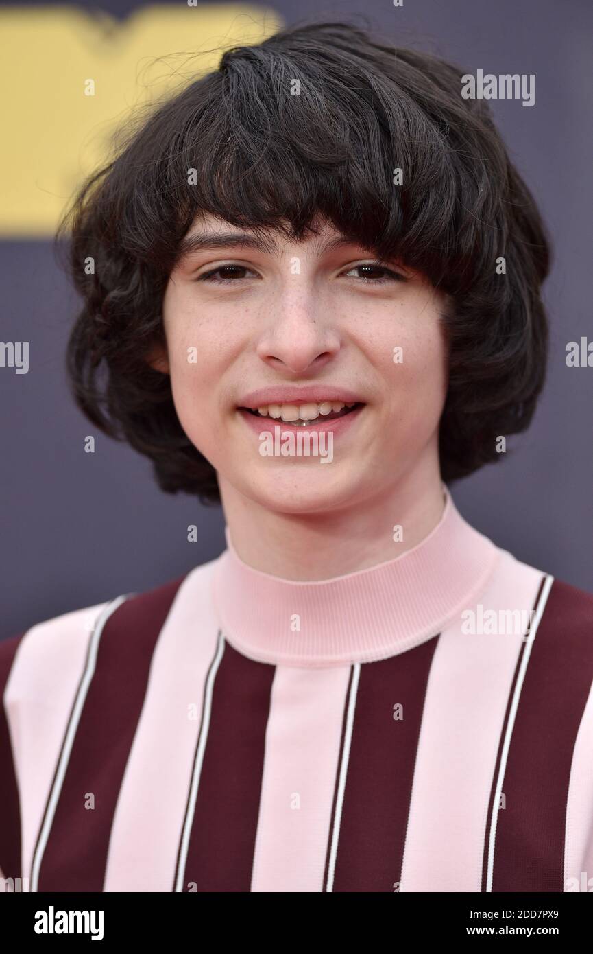 Finn Wolfhard attends the 2018 MTV Movie And TV Awards at Barker Hangar ...