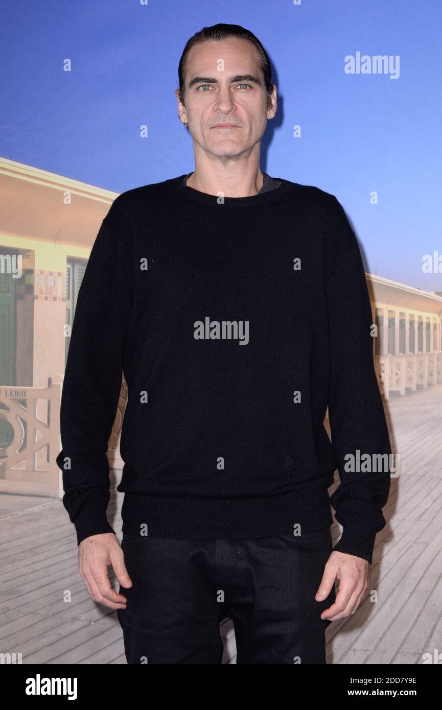 Joaquin Phoenix attending a photocall for the movie The Sisters ...