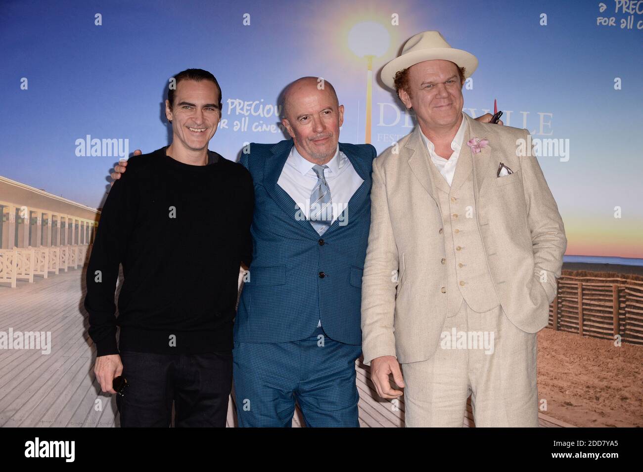 Joaquin Phoenix, Jacques Audiard, John C. Reilly attending a photocall ...