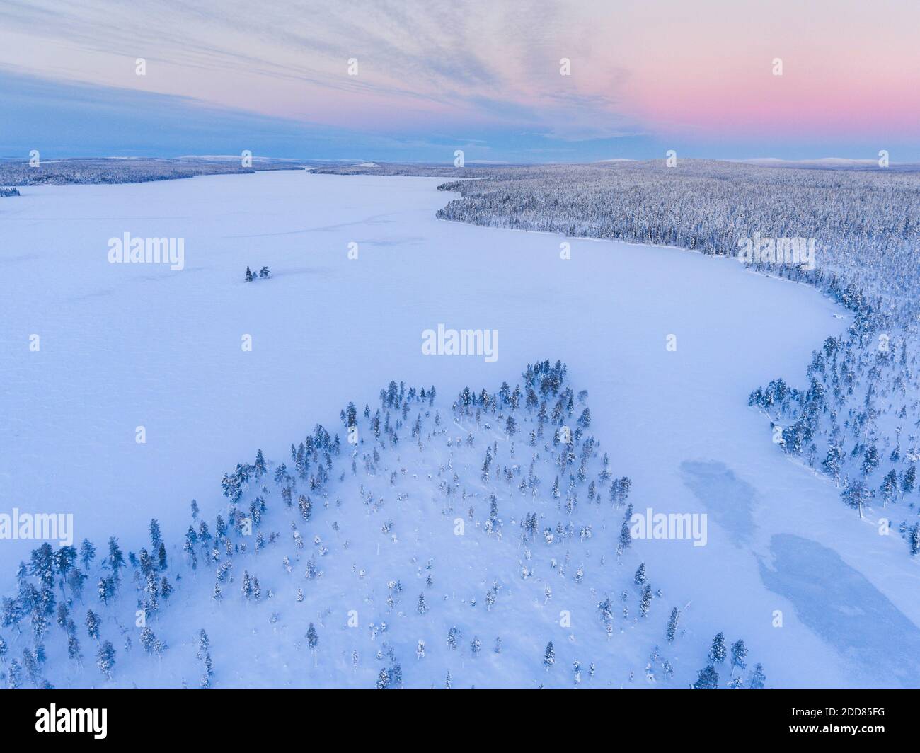 Snow covered lake and forest winter landscape showing amazing Lapland ...
