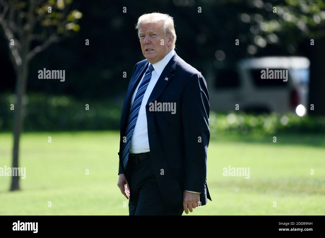 U.S President Donald Trump walks on the South Lawn as he departs the ...