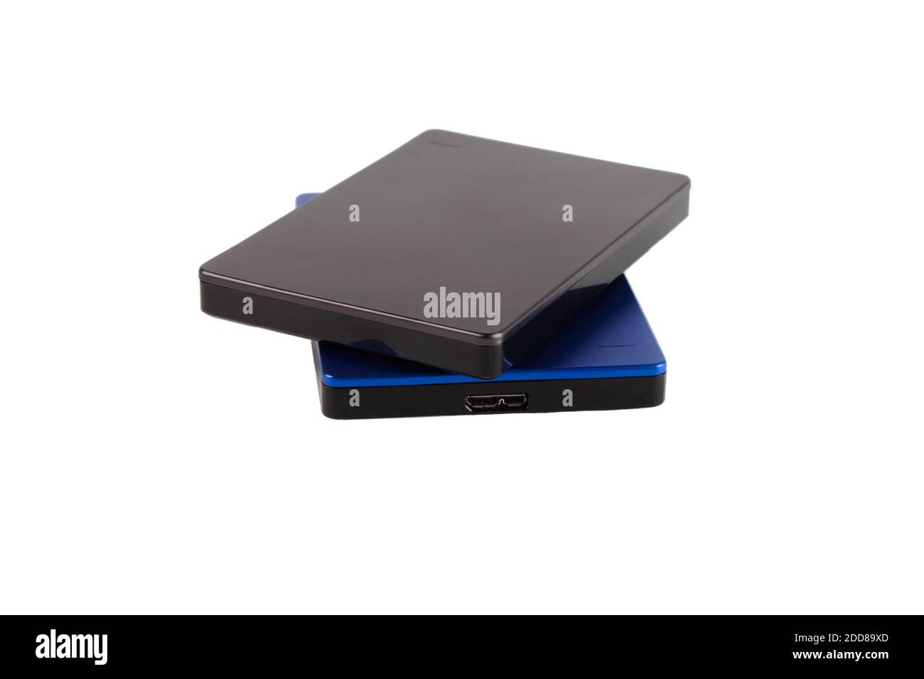 Two external hard drives (blue and black) lying on top of each other ...