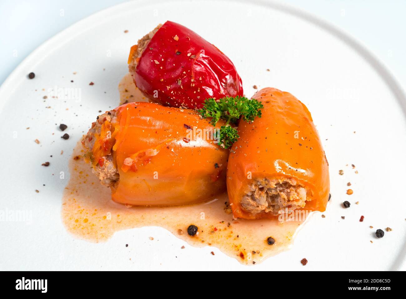 Bell pepper with minced meat on a light background Stock Photo - Alamy