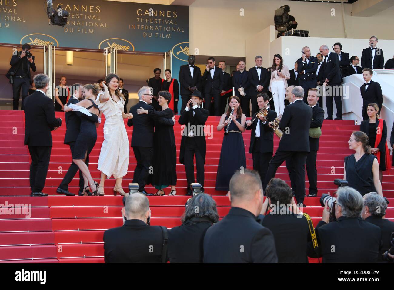 Singer Camille dances as musicians play on the red carpet before the ...