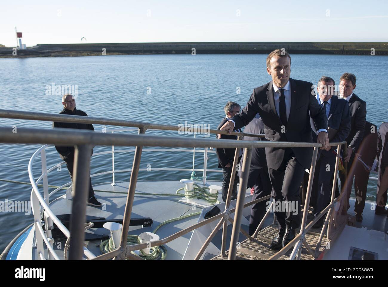 French President Emmanuel Macron leaves the fishing boat the "Corail 1 ...