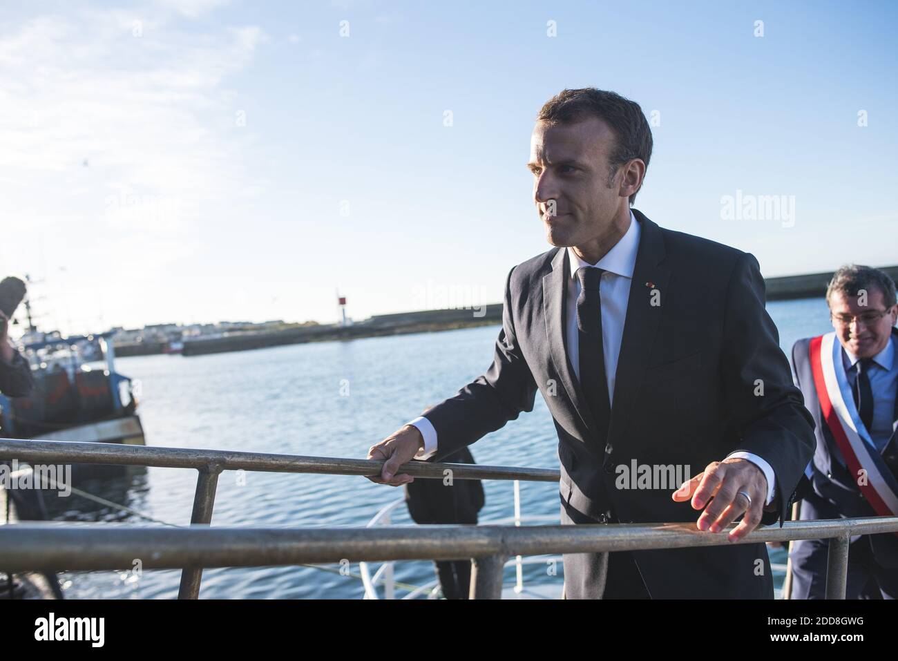 French President Emmanuel Macron leaves the fishing boat the "Corail 1 ...