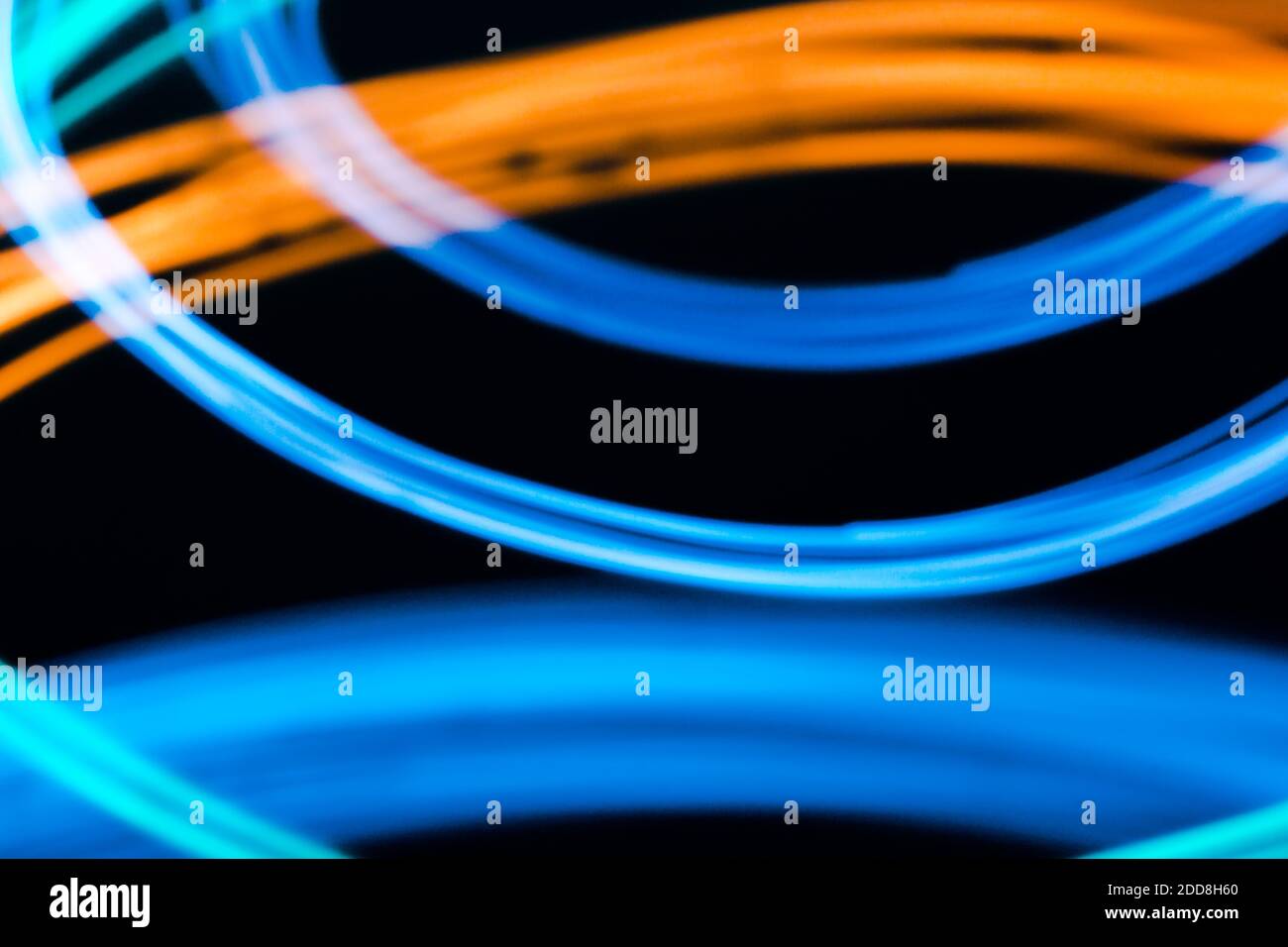 Futuristic defocused abstraction with space for text. Orange, cyan, and ...