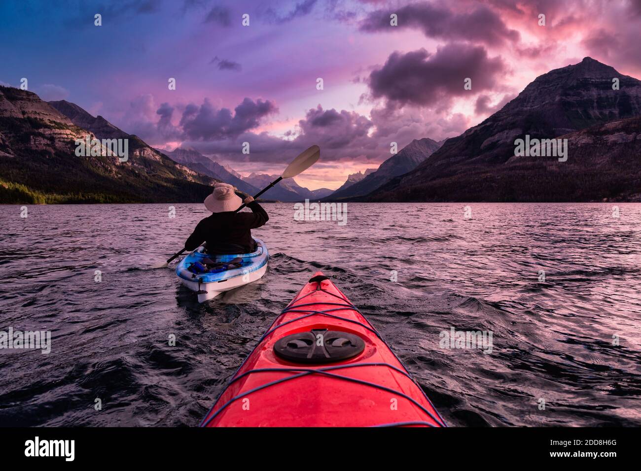 Adventurous Man Kayaking in Glacier Lake Stock Photo - Alamy