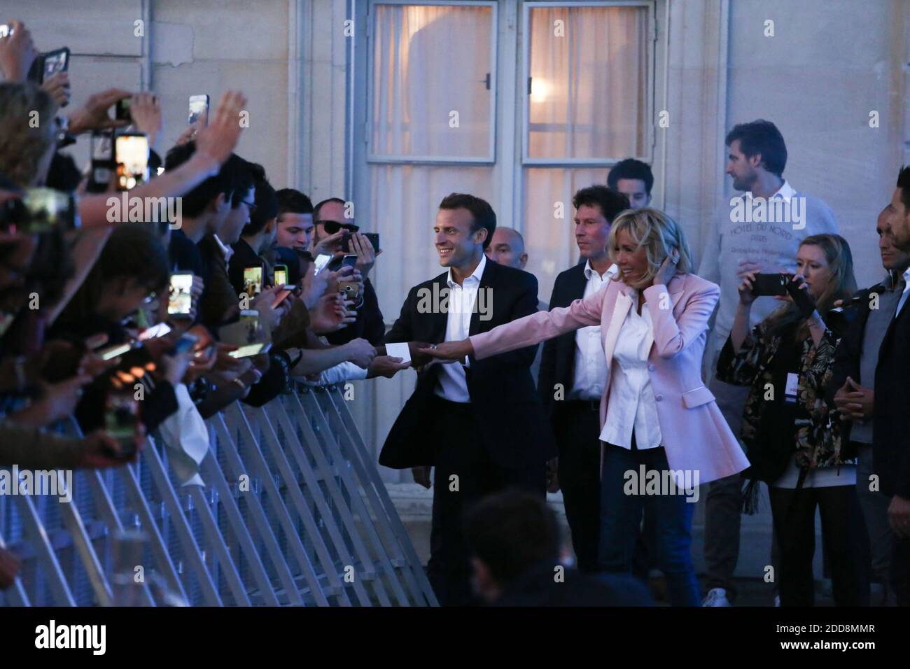 French president Emmanuel Macron and his wife Brigitte Macron open the ...