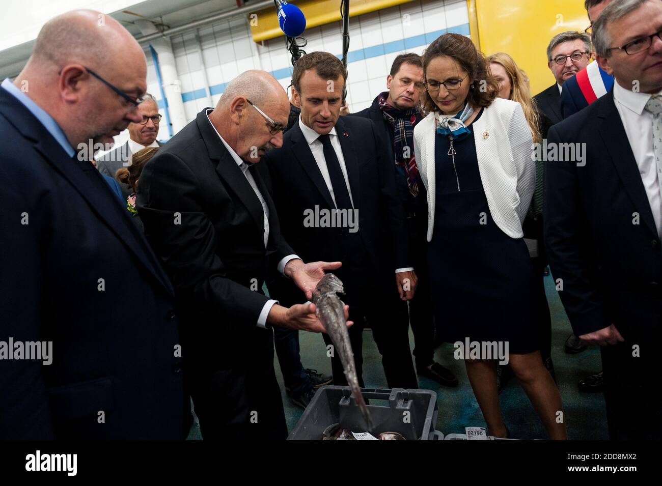 French President Emmanuel Macron visits the fish market on June 21 ...